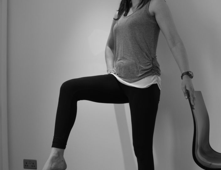 Standing-leg-lift-for-balance-and-strength-705×543